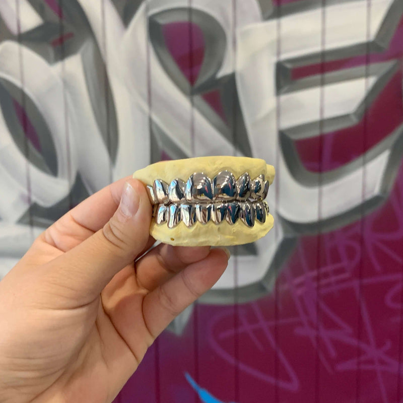 8 Piece Solid Top & Bottom Grillz Set · Mouth House